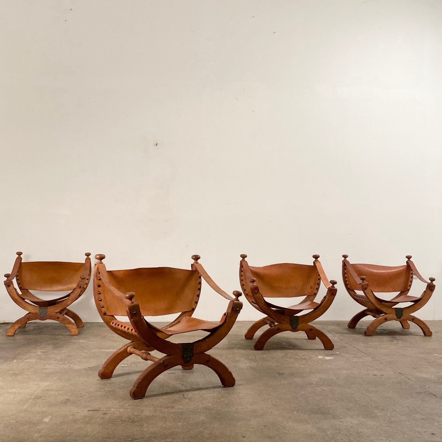 leather curule chairs – Objet Vagabond